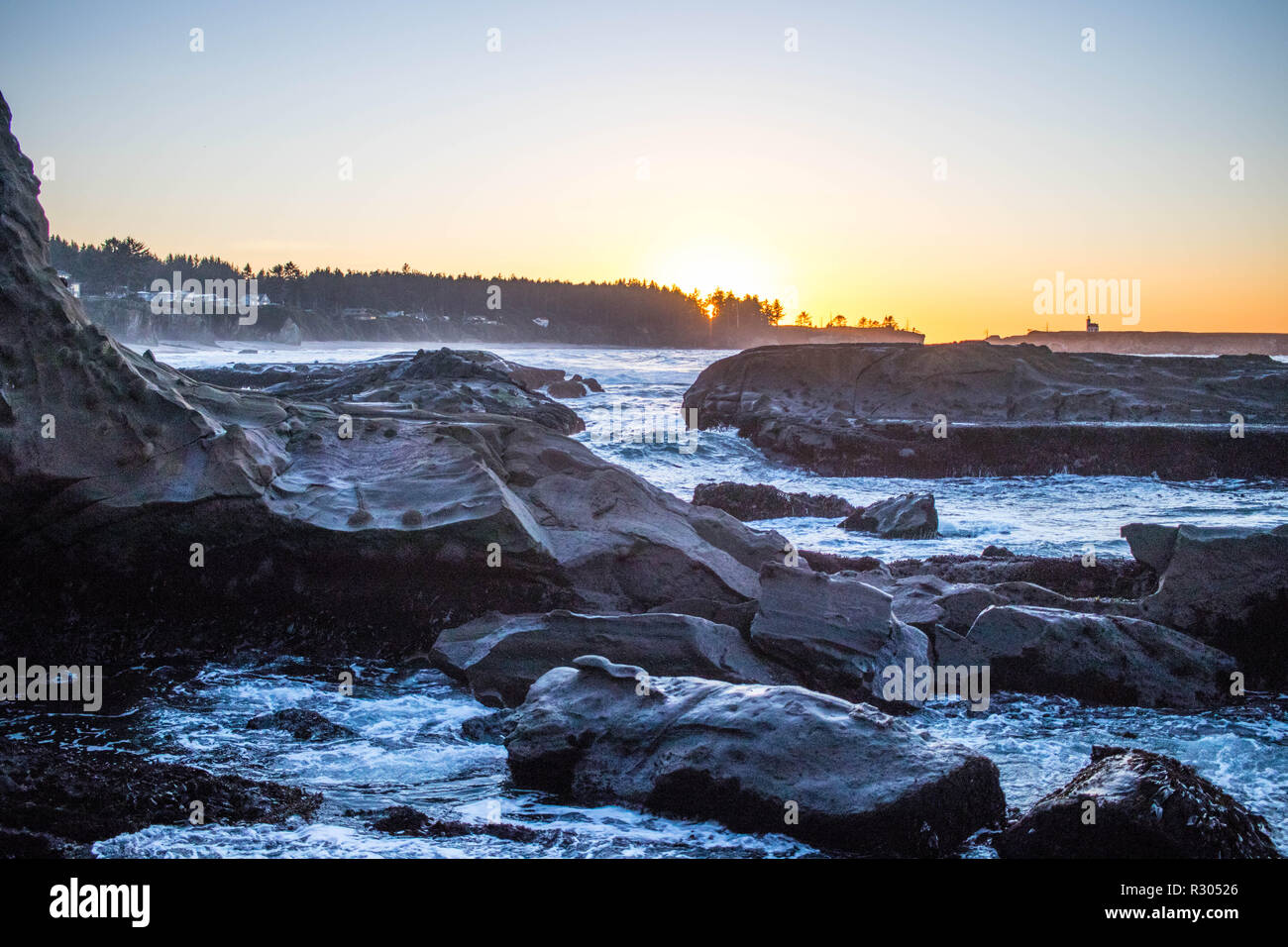 Sunset Bay State Park lives up to it's name as the setting sun casts a ...