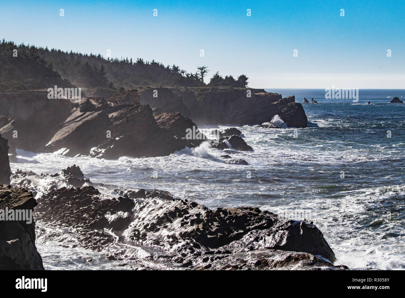 Waves crash among the jagged rocks of the southern Oregon coast at ...