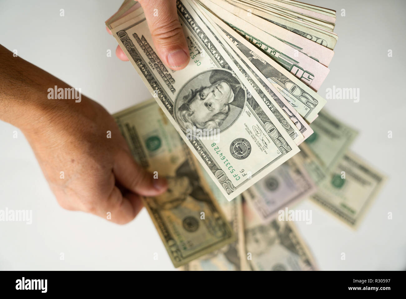 Selective focus of hands counting dollar bills isolated on white ...