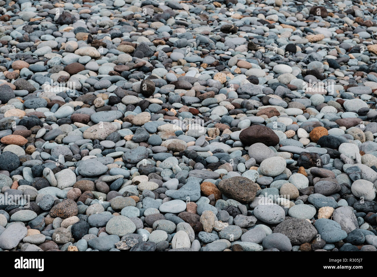 pebble stone beach - stones at ocean coast Stock Photo - Alamy