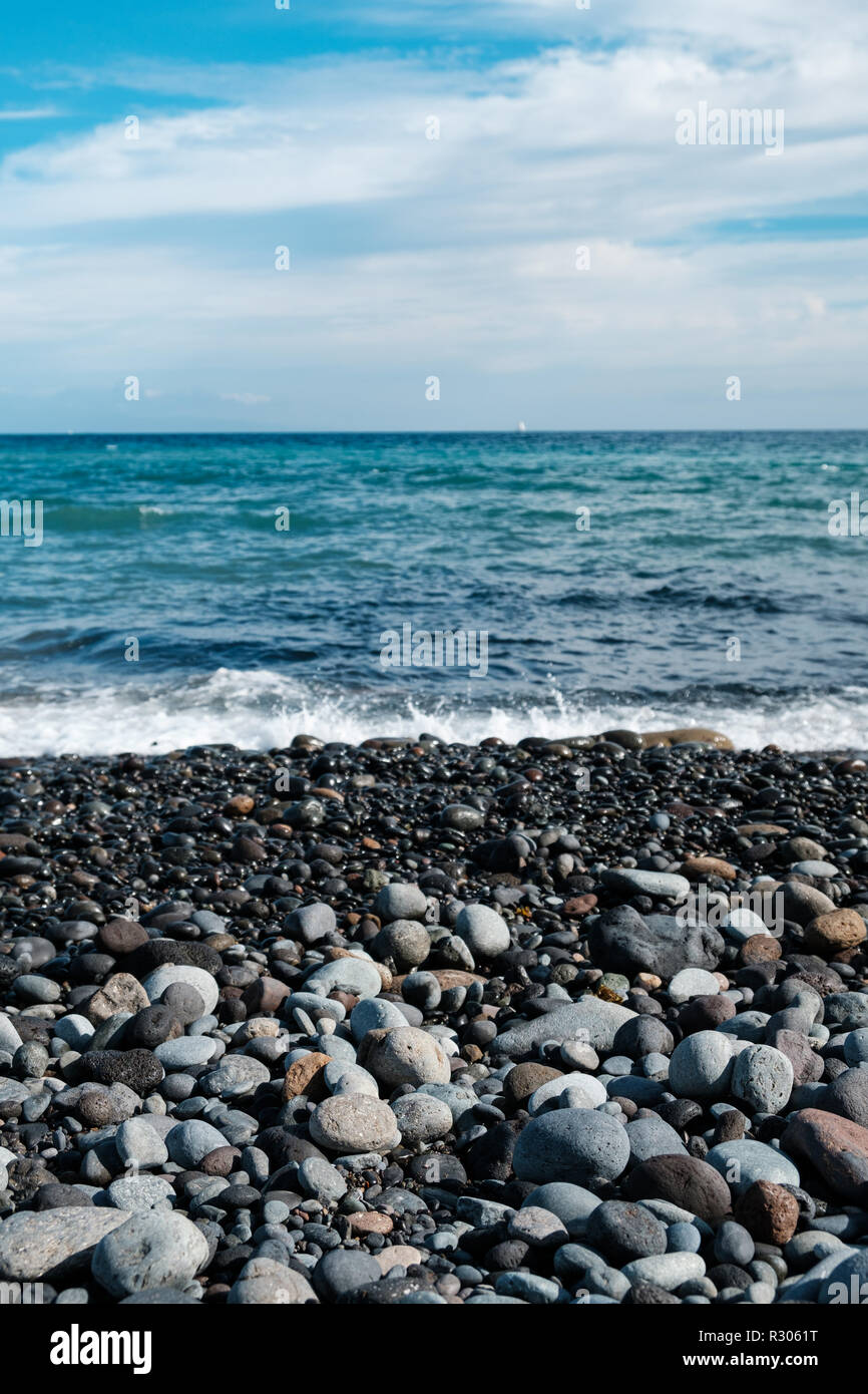 pebble stone beach - stones at ocean coast Stock Photo - Alamy