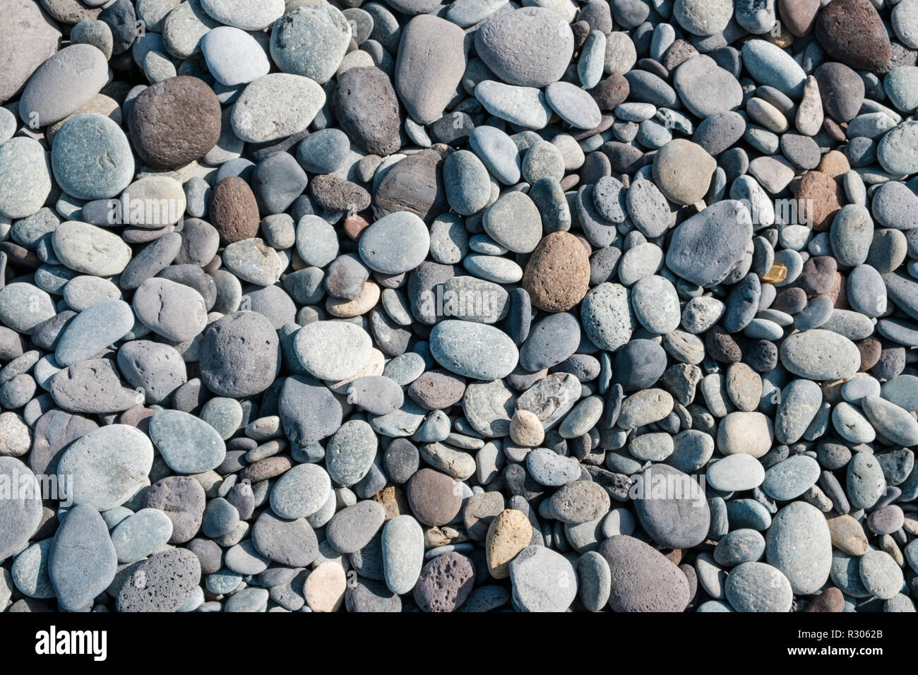 pebble stone beach - stones at ocean coast Stock Photo - Alamy