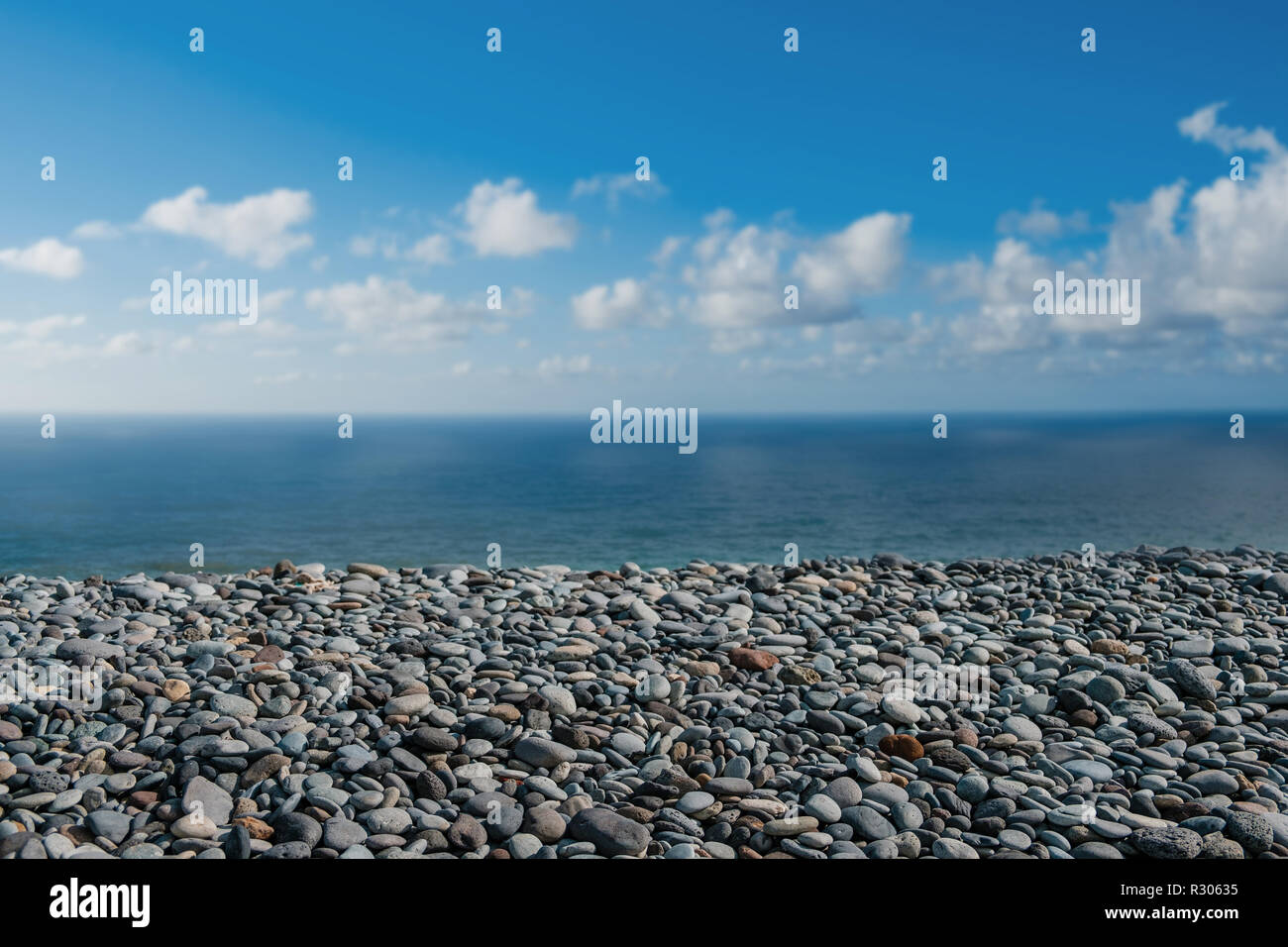 pebble stone beach - stones at ocean coast Stock Photo - Alamy