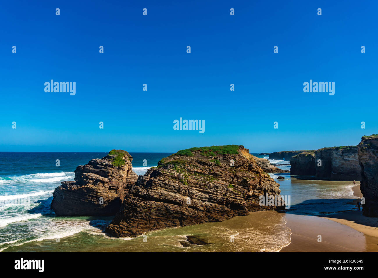The huge rock formations on the Playa de las Catedrales in Spain Stock ...