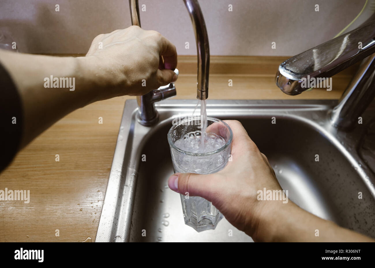 Man drinking water from tap hi-res stock photography and images - Alamy