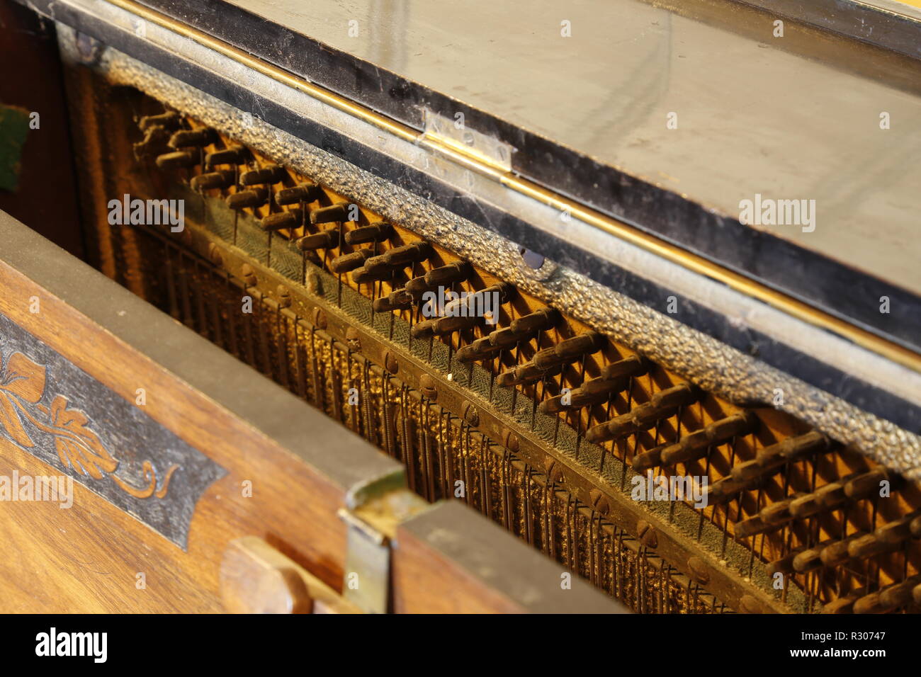 Inside old upright piano in hallway Stock Photo - Alamy