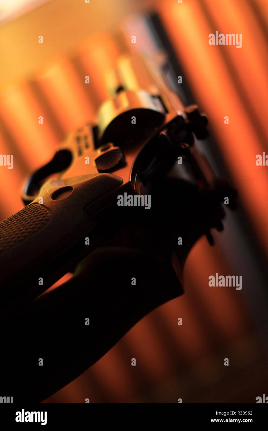 Pistol automatic handgun weapon on table in hotel bedroom in ...