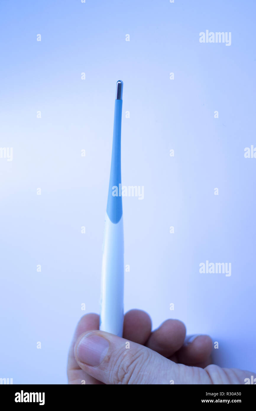 Digital medical thermometer instrument used by doctor or nurse to ...
