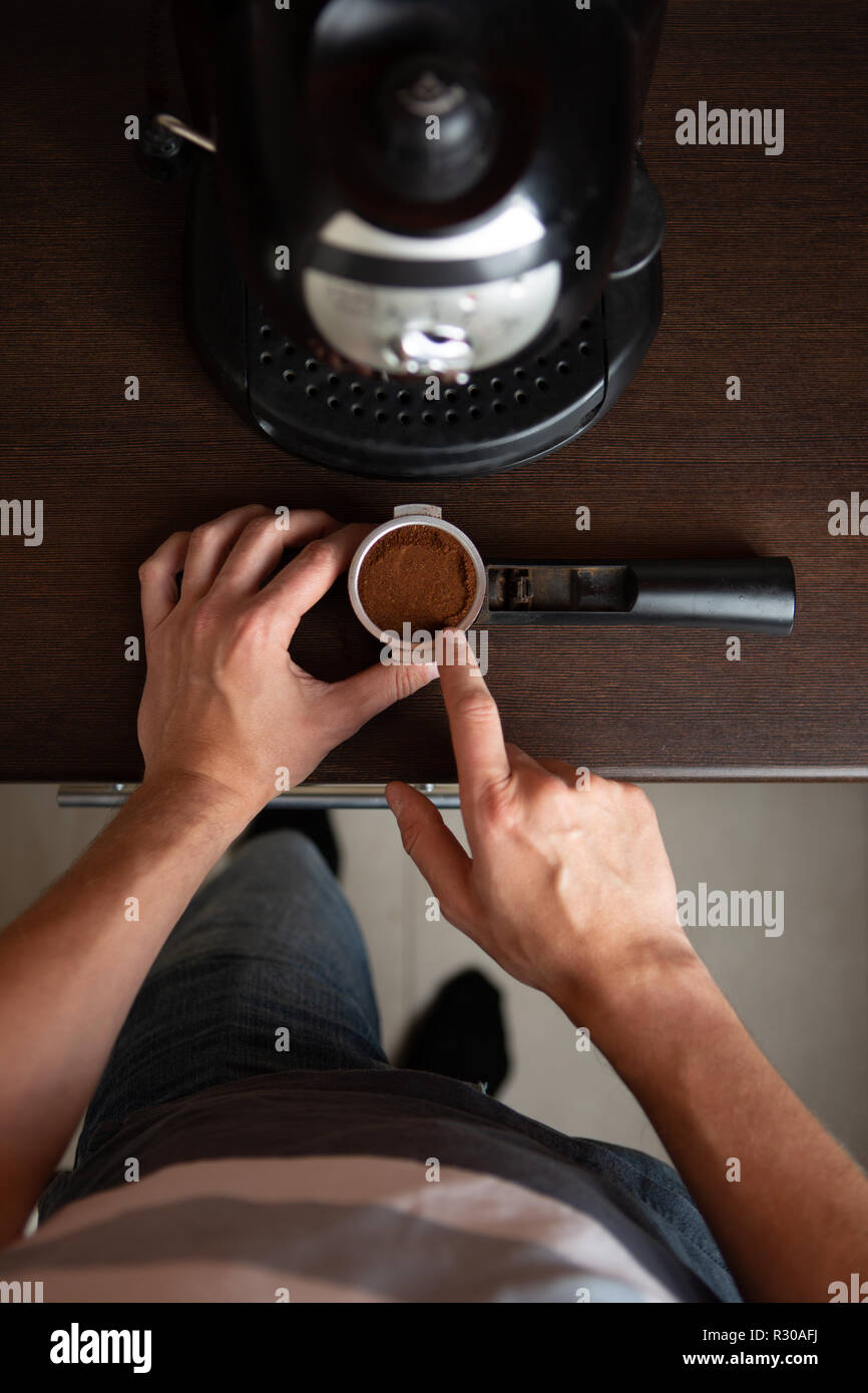 Photo of coffee maker, man hand pouring coffee Stock Photo - Alamy