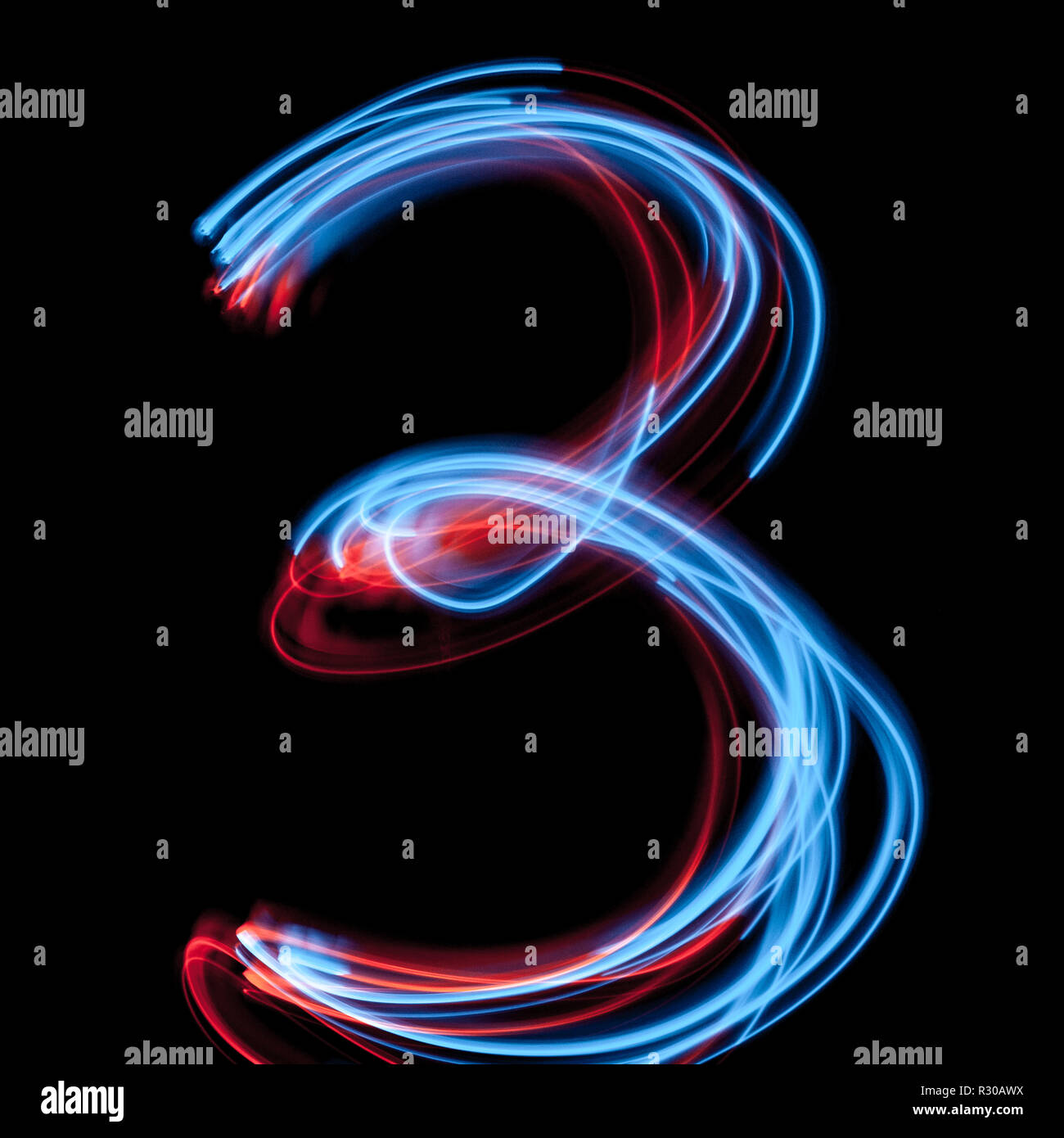 The neon number 3, blue light image, long exposure with colored fairy ...