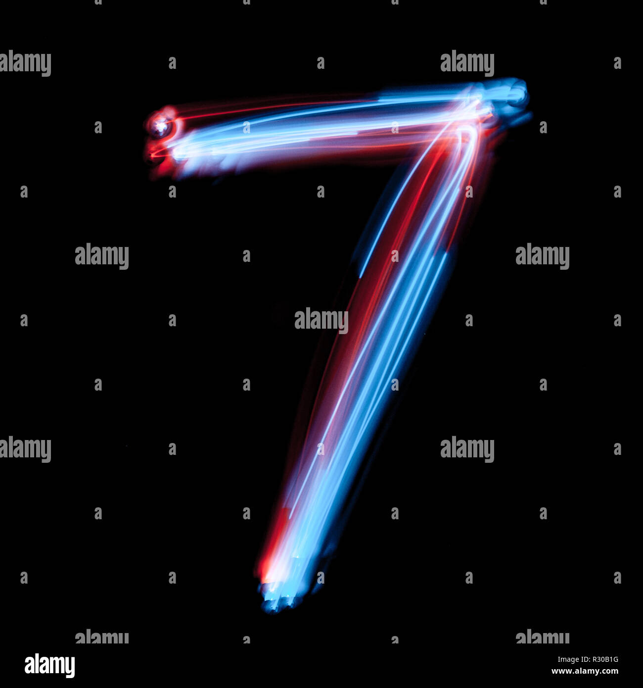The neon number 7, blue light image, long exposure with colored fairy ...