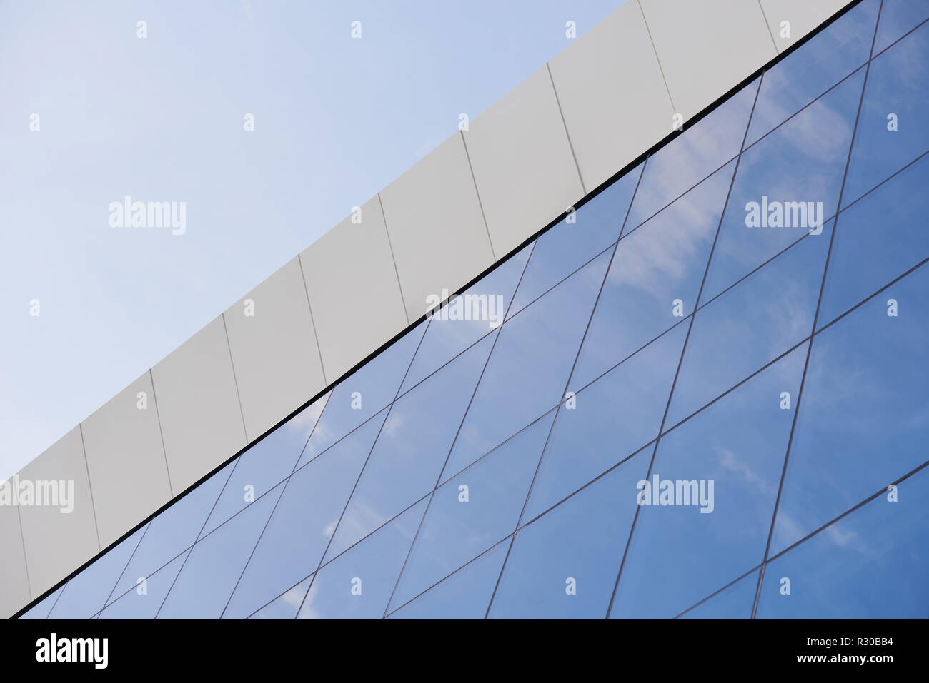 White roof with blue windows of commercial building Stock Photo - Alamy