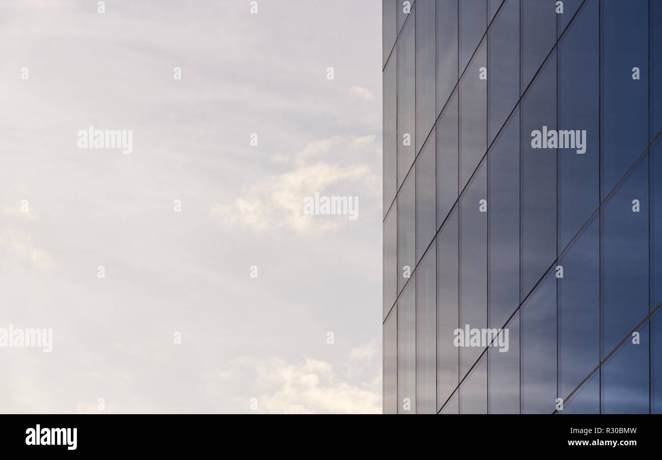 Modern commercial building wall on sunset sky background Stock Photo ...