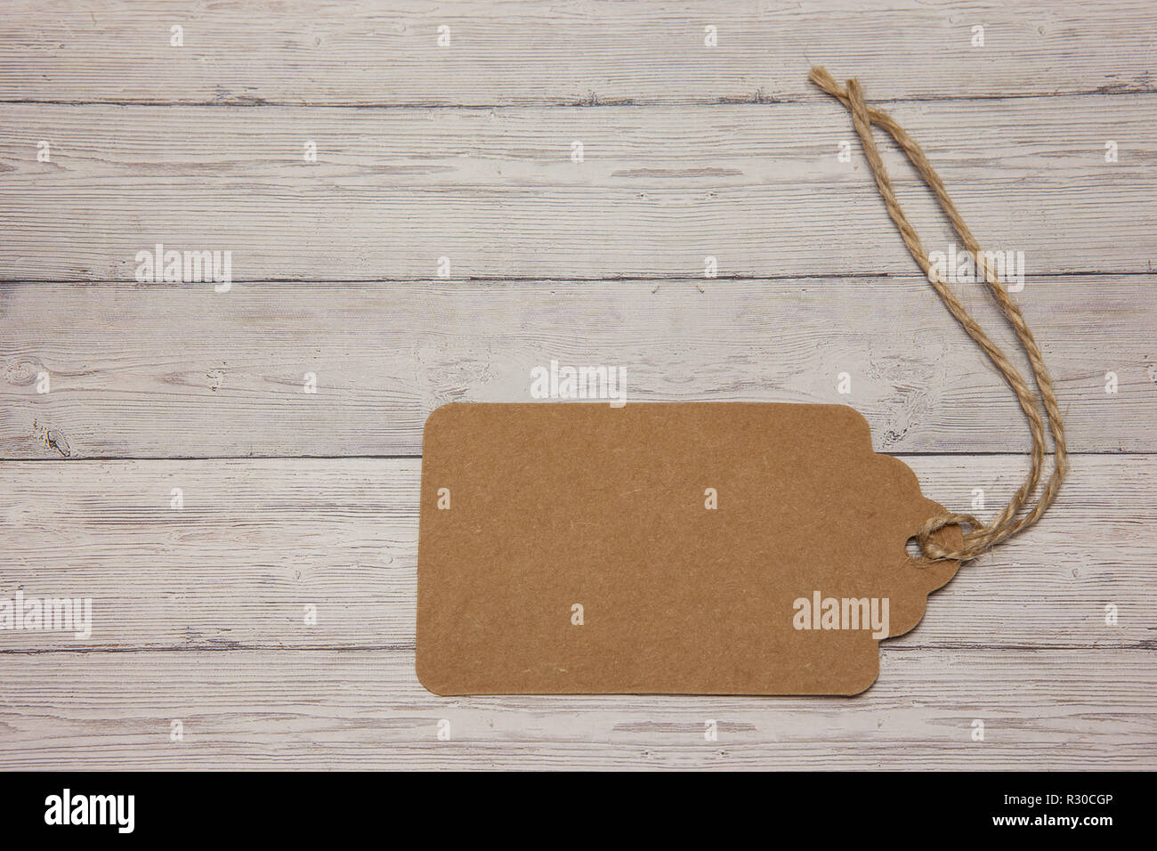 Top view. Price tag on wooden background, close-up Stock Photo - Alamy