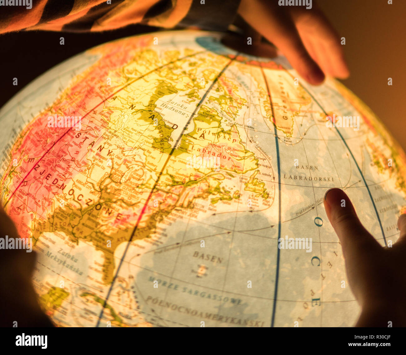 looking for a location on an earth model map Stock Photo - Alamy