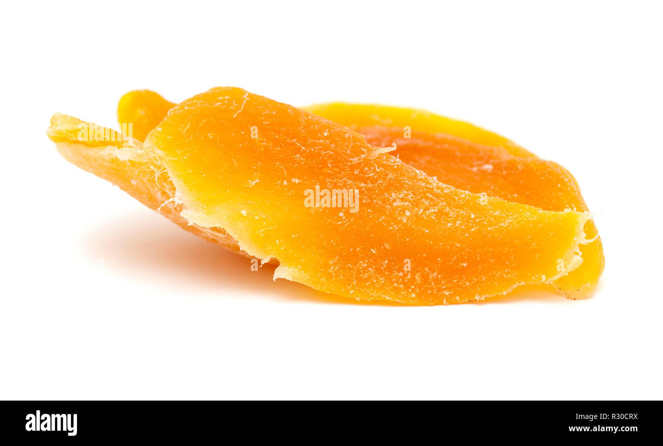 dried fruit isolated on white background - yellow mango fragments Stock ...