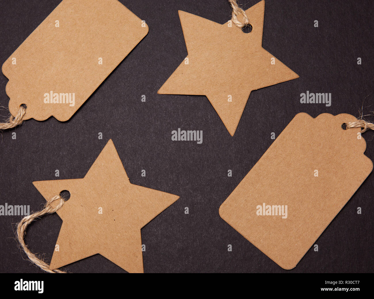 Close-up, price tags in the shape of a star and a rectangle on a black ...