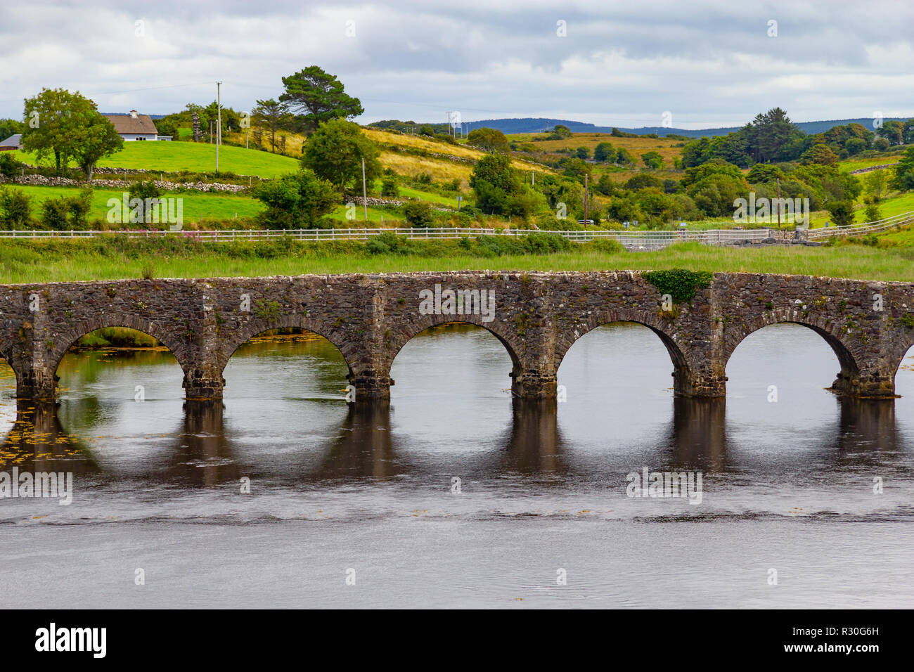 River, stone bridge and farms in background, Great Western Greenway ...