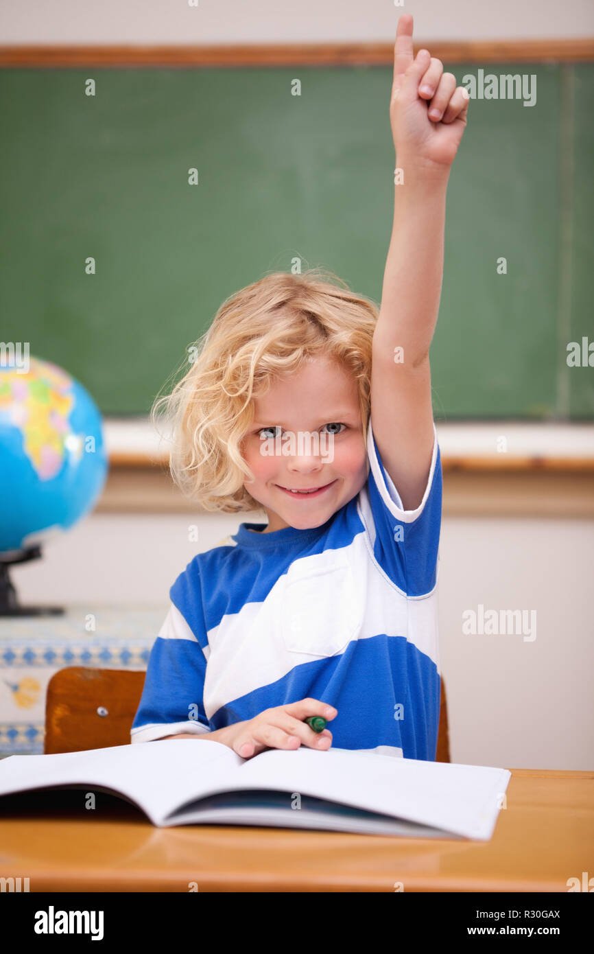 Boy raising hand ask question hi-res stock photography and images - Alamy