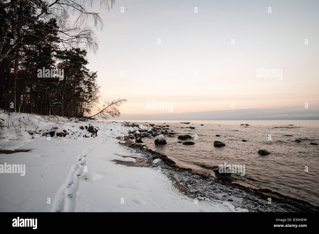 frozen sea side beach panorama in winter with lots of ice and snow in ...