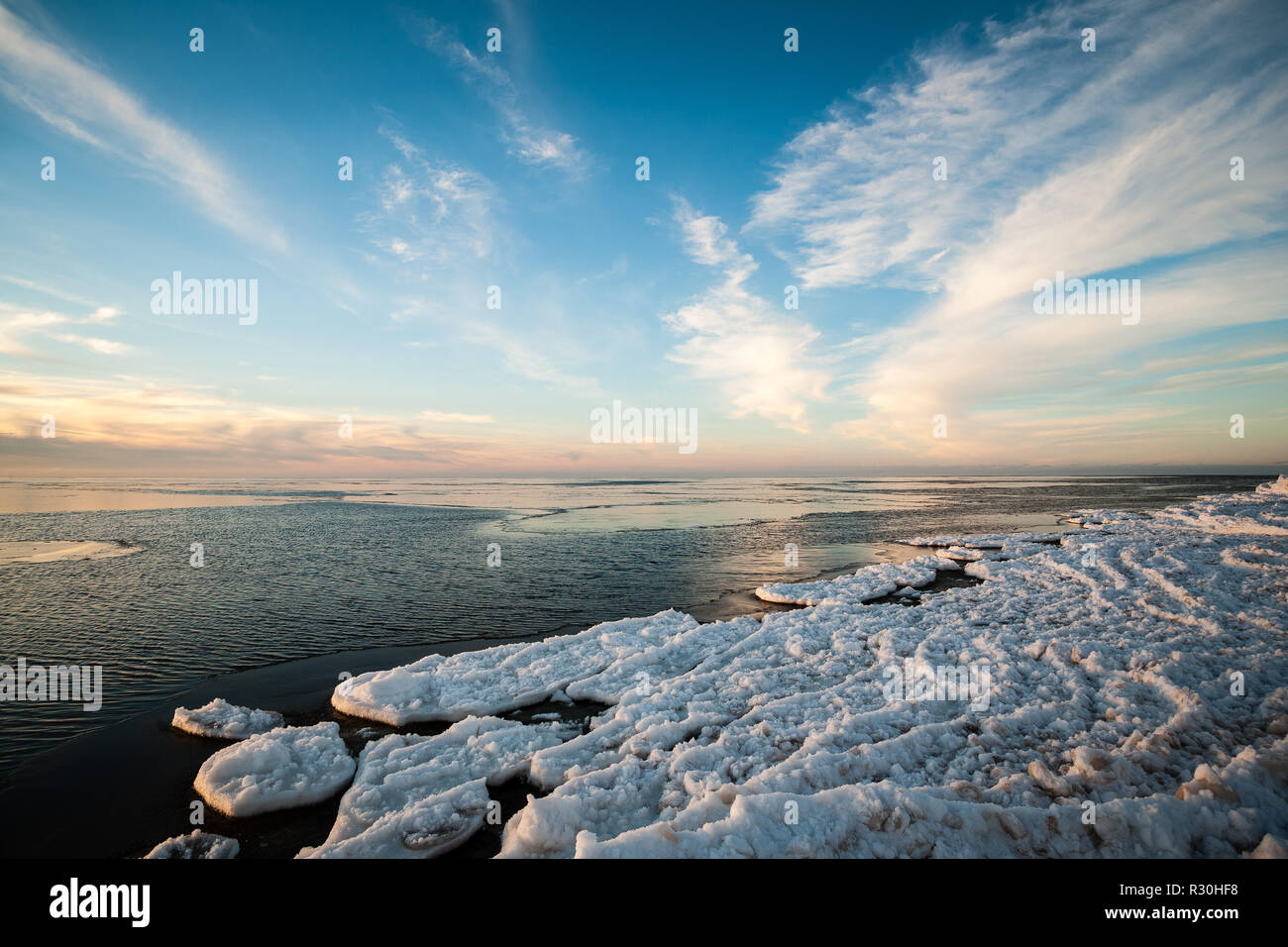 frozen sea side beach panorama in winter with lots of ice and snow in ...