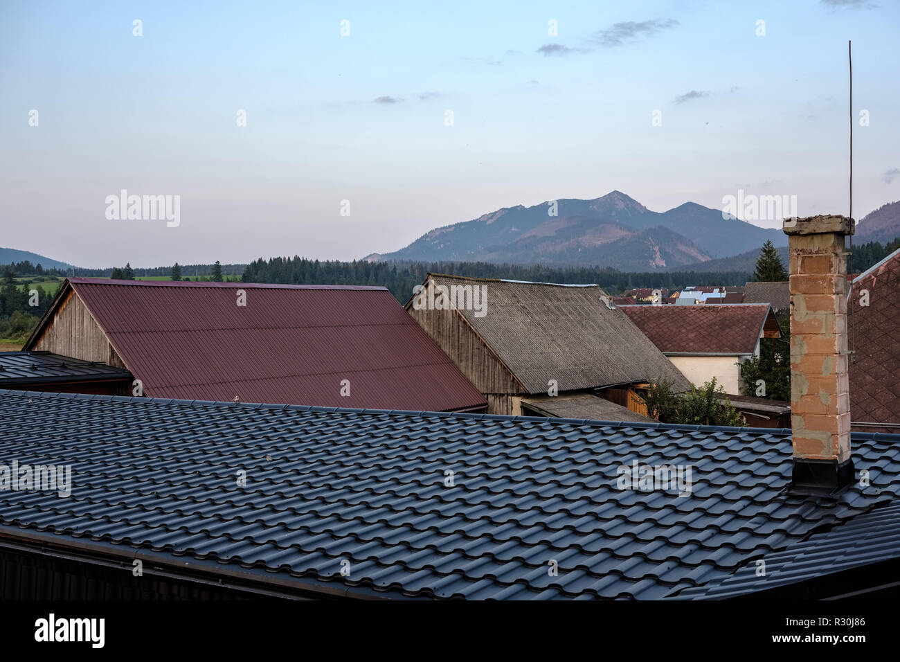 country village rooftops in Slovakia with mountains in background Stock ...