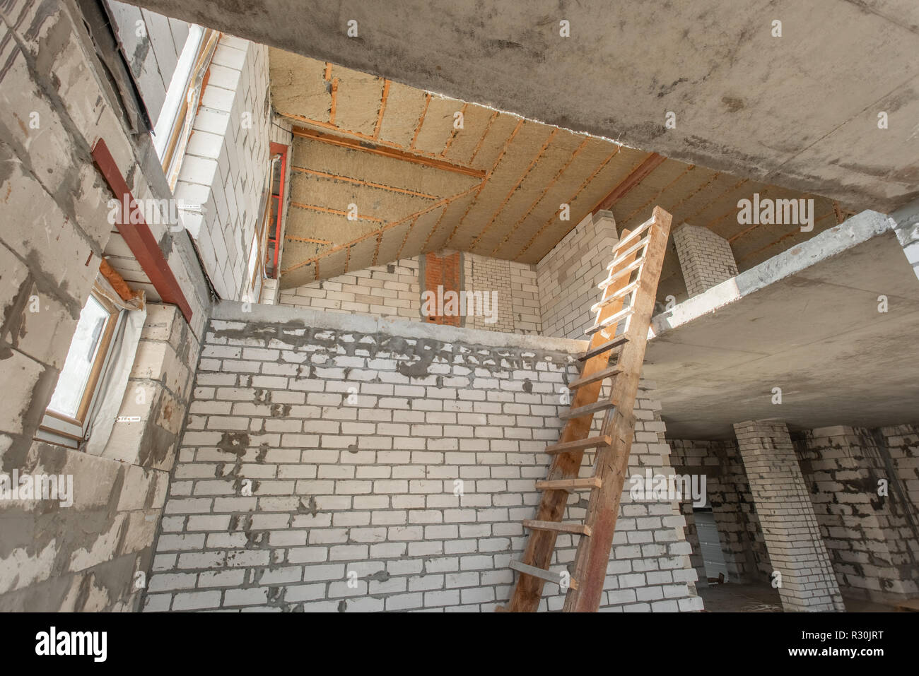 The second attic floor of the house. overhaul and reconstruction. Working process of warming ...