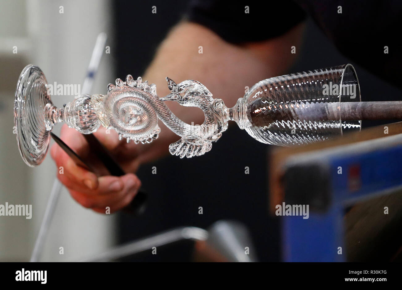 A glass is made for the Prince of Wales during his tour of the Dyson ...