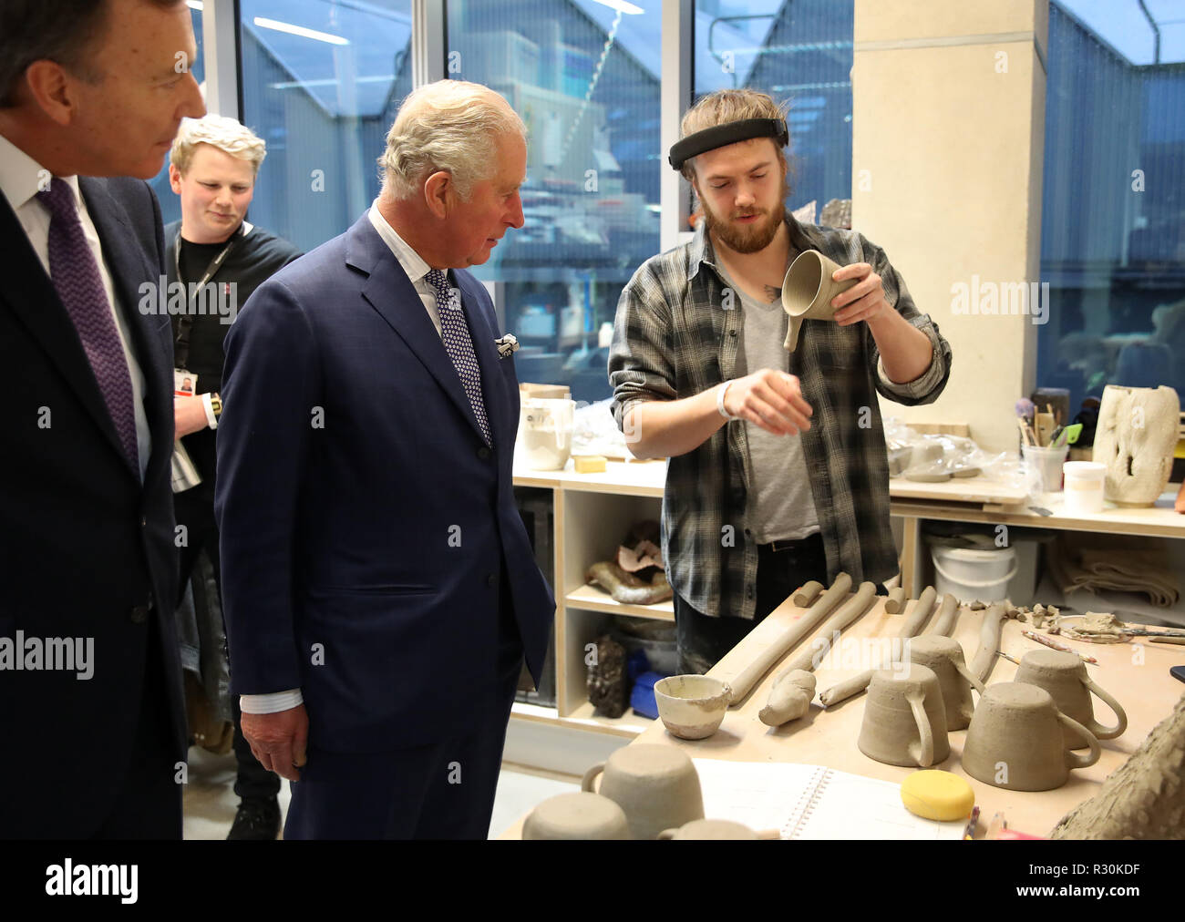 The Prince of Wales speaks to student Oliver Harding during a tour of ...