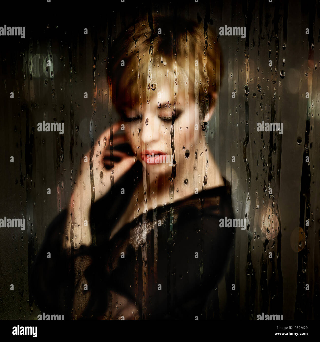 Woman in rain scotland hi-res stock photography and images - Alamy