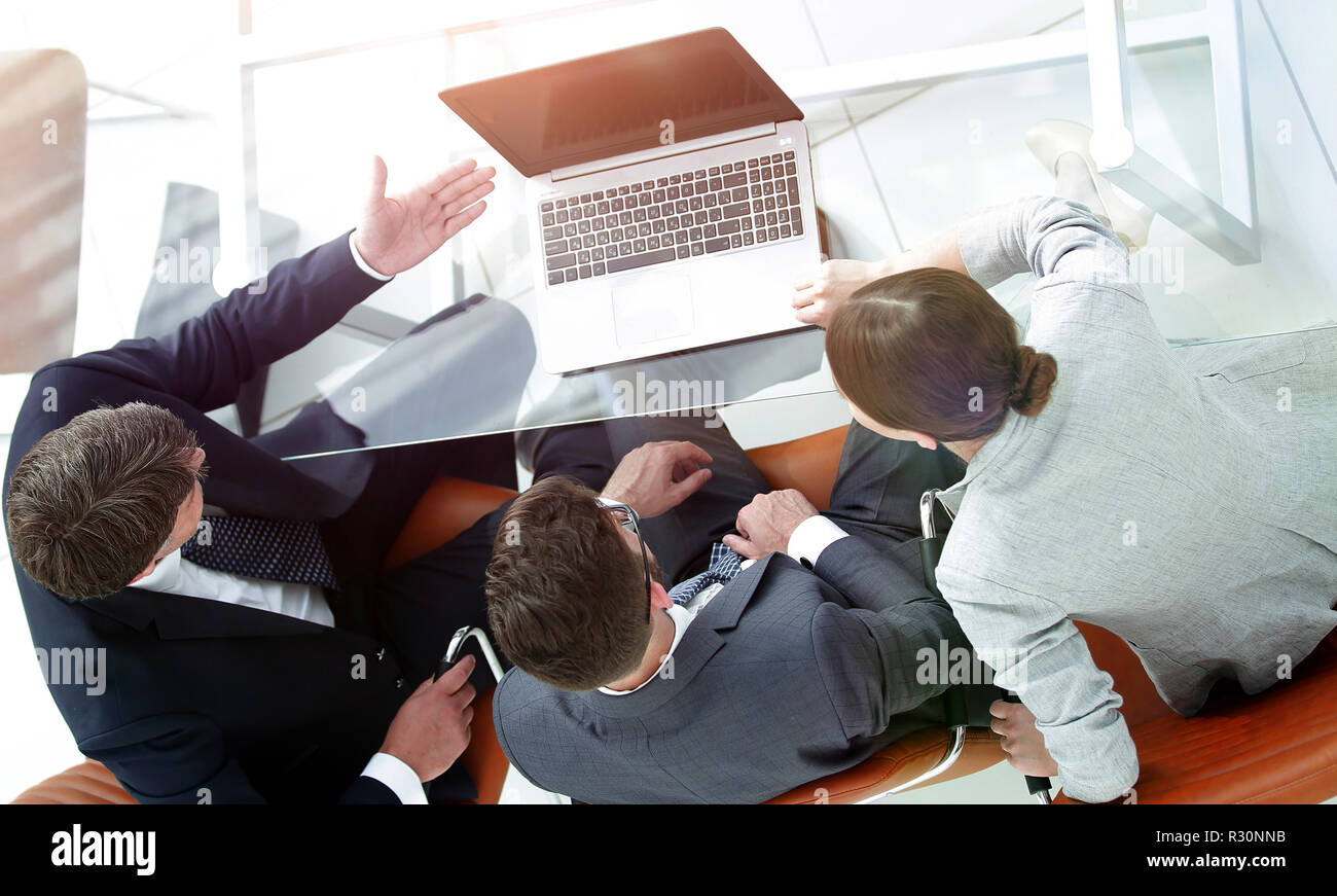 Business team working with laptop at work desk Stock Photo - Alamy