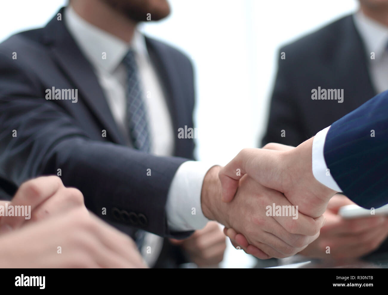 Close-up image of a firm handshake Stock Photo - Alamy