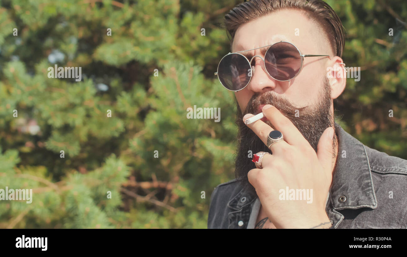 Bearded beard male smoke hi-res stock photography and images - Alamy
