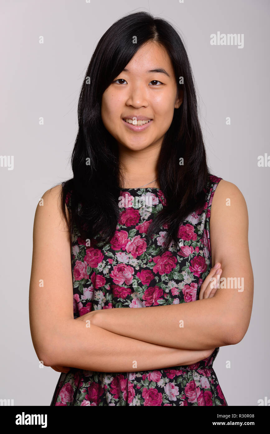 Studio portrait of young happy Asian woman Stock Photo - Alamy
