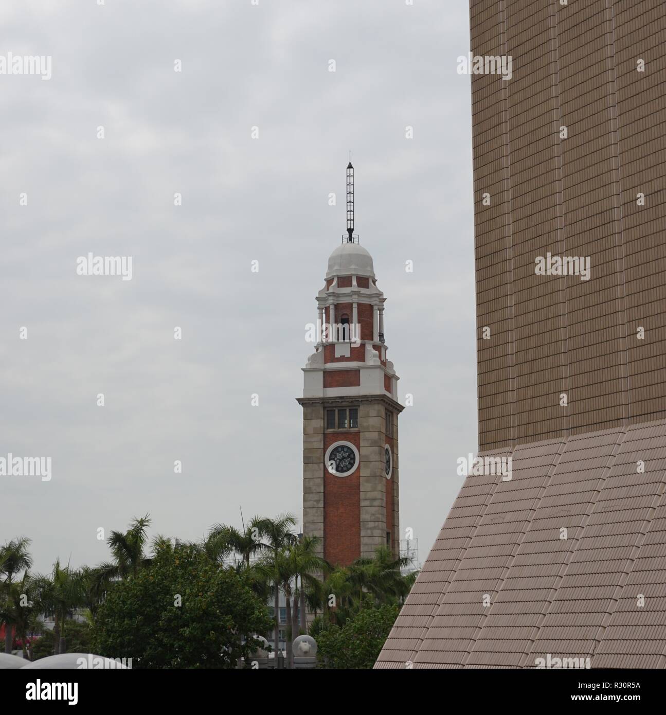 Tsim Sha Tsui Clock Tower behind the Hong Kong Cultural Center Stock Photo - Alamy
