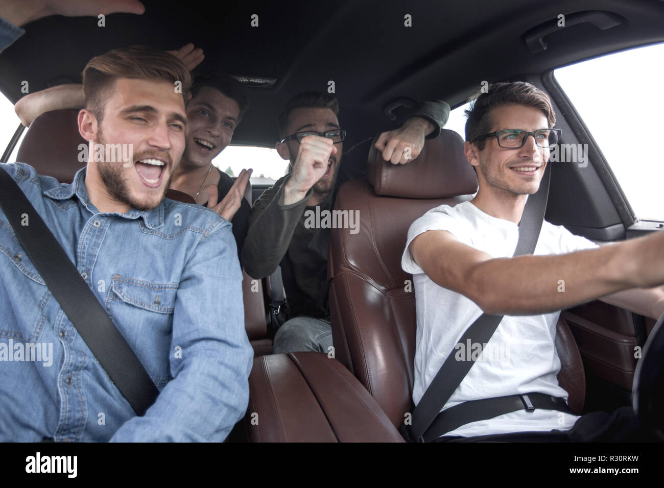 close up.happy friends talking in the car Stock Photo - Alamy