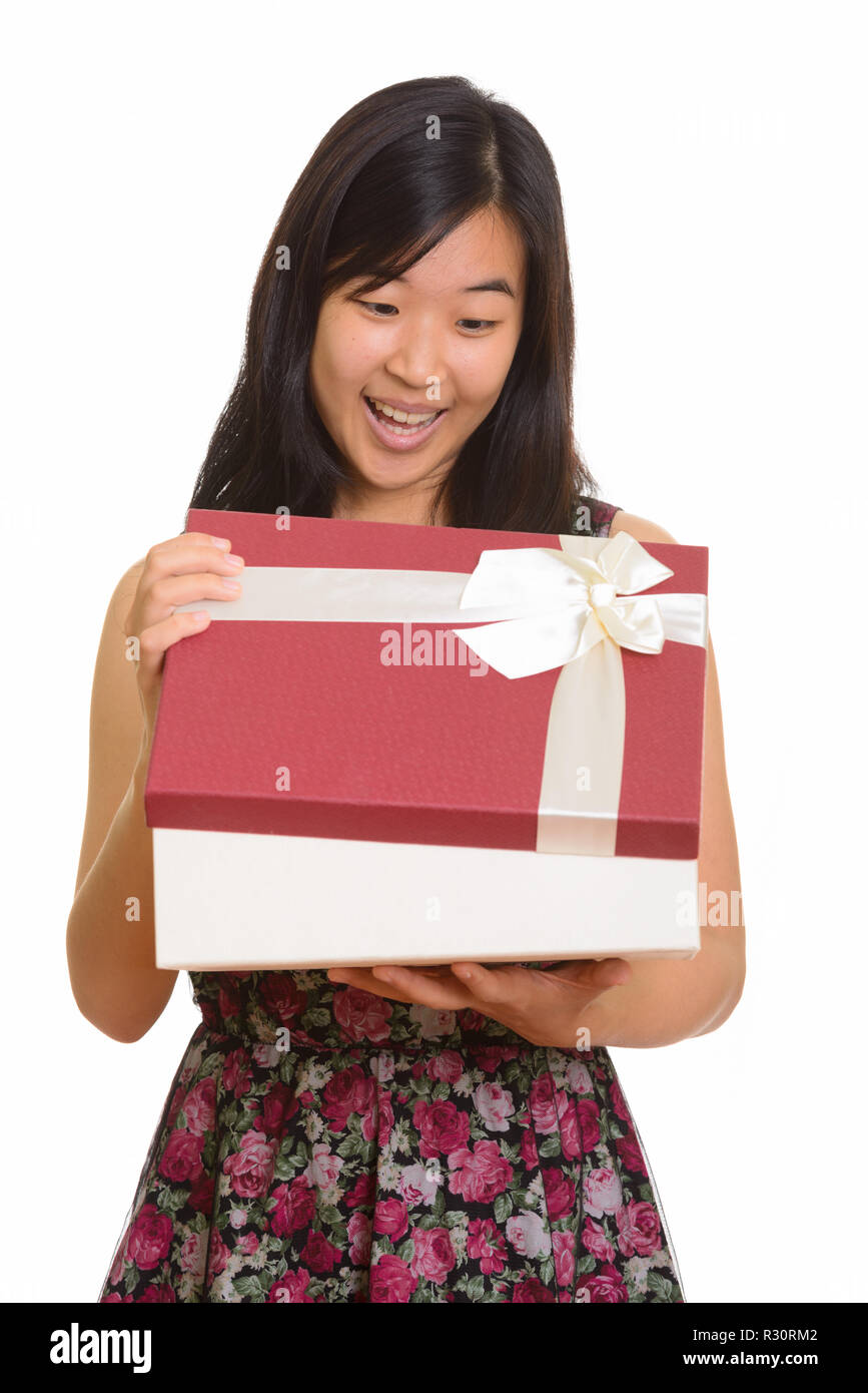 Young happy Asian woman opening gift box Stock Photo - Alamy