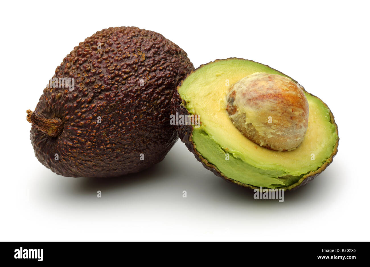 Avocado pieces isolated on white background Stock Photo - Alamy