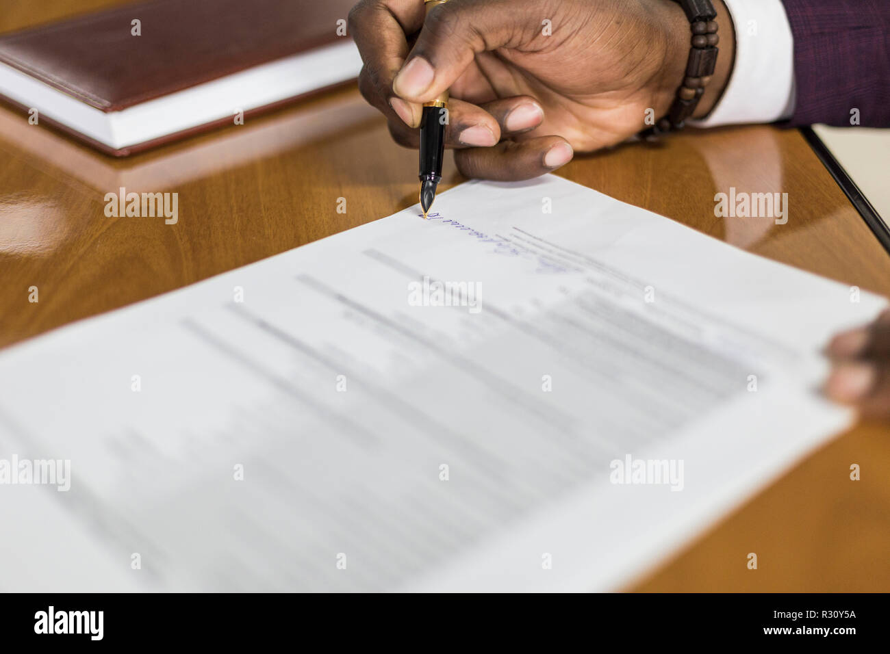 African american man signing contract, black man hand putting signature ...