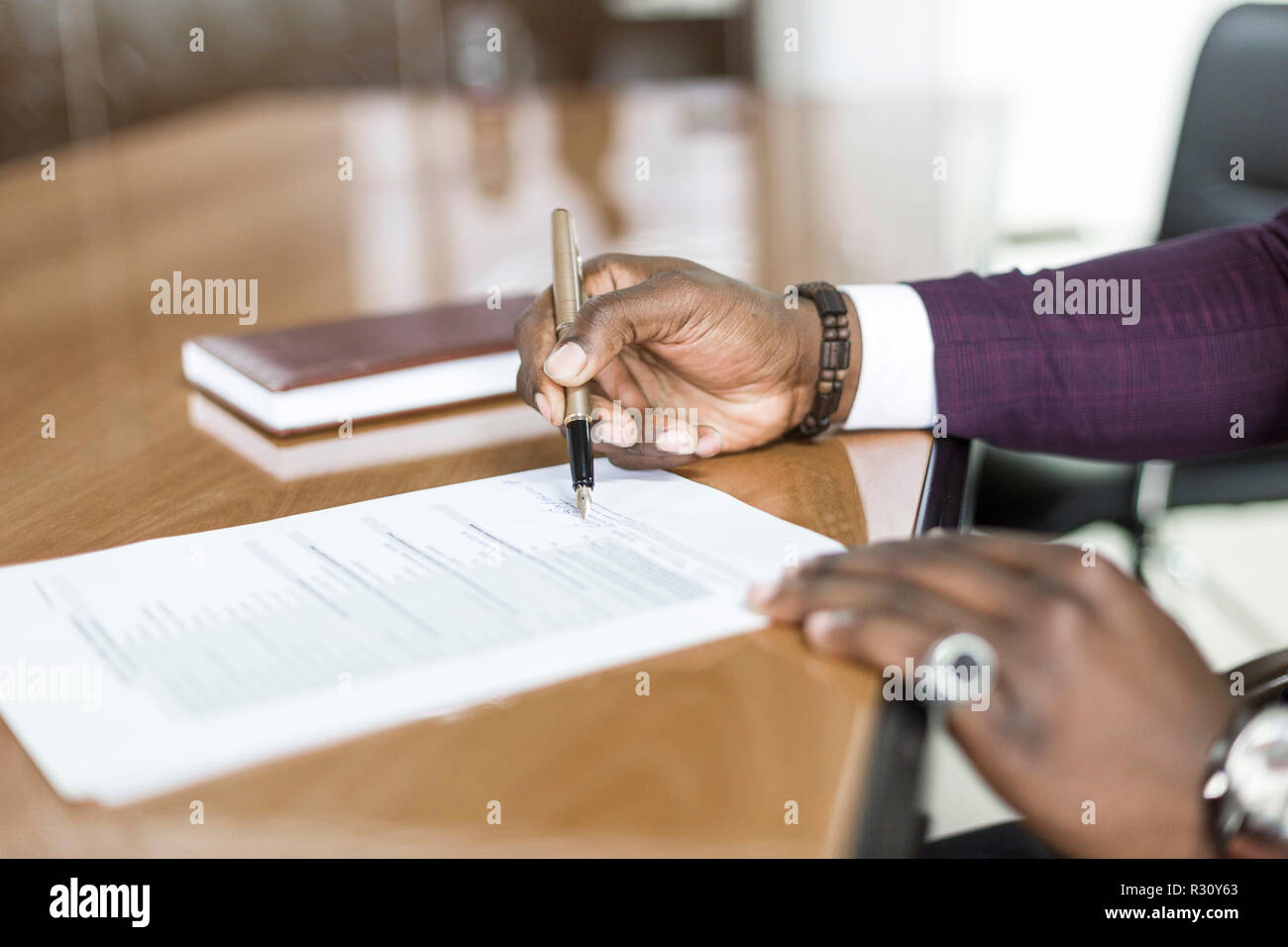 African american man signing contract, black man hand putting signature ...