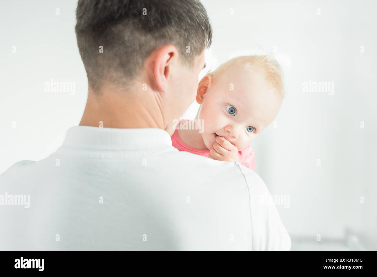 young happy family. father and little baby yawns near a lullaby ...
