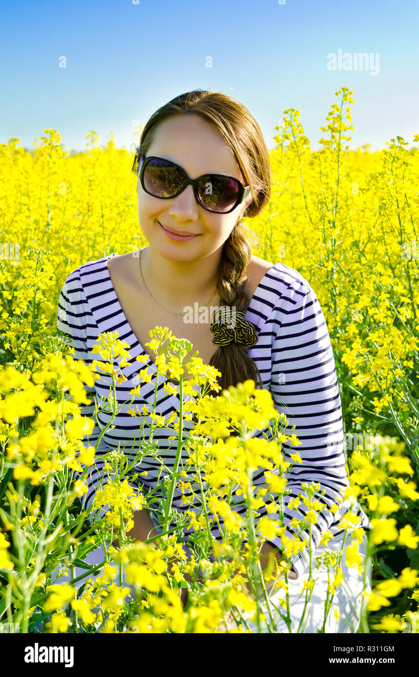 Girl sitting in flower field hi-res stock photography and images - Alamy