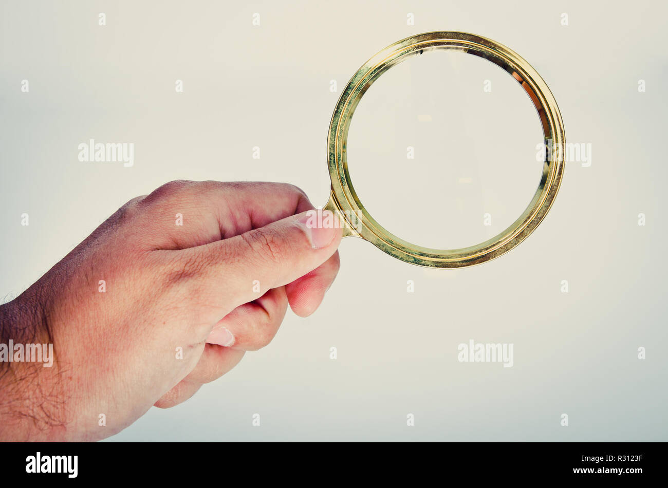 magnifying glass in a hand Stock Photo - Alamy