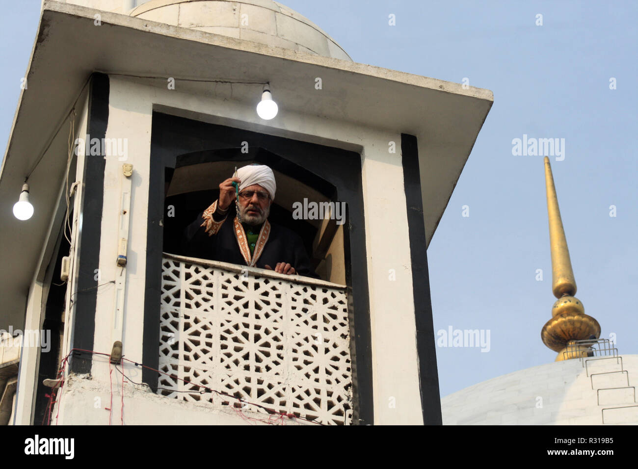 Srinagar, Kashmir. 21st November, 2018. A Kashmiri cleric displays a ...
