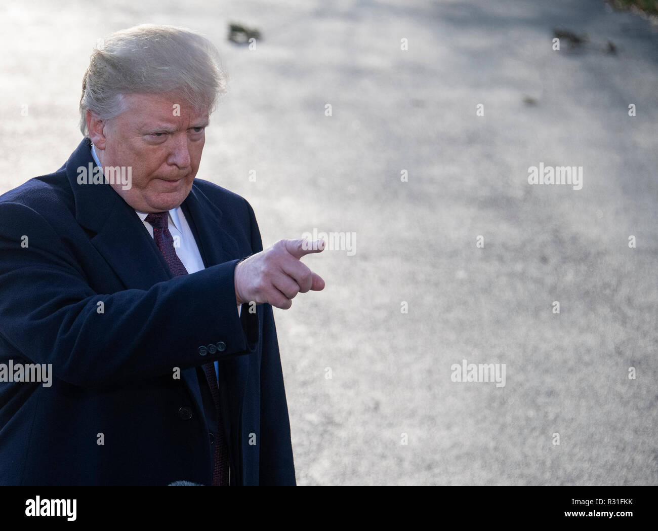 United States President Donald J. Trump points to a reporter as he ...