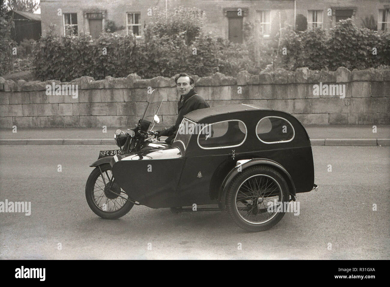 1950, historical, man on motorcycle with roofed 'Watsonian' sidecar. In ...