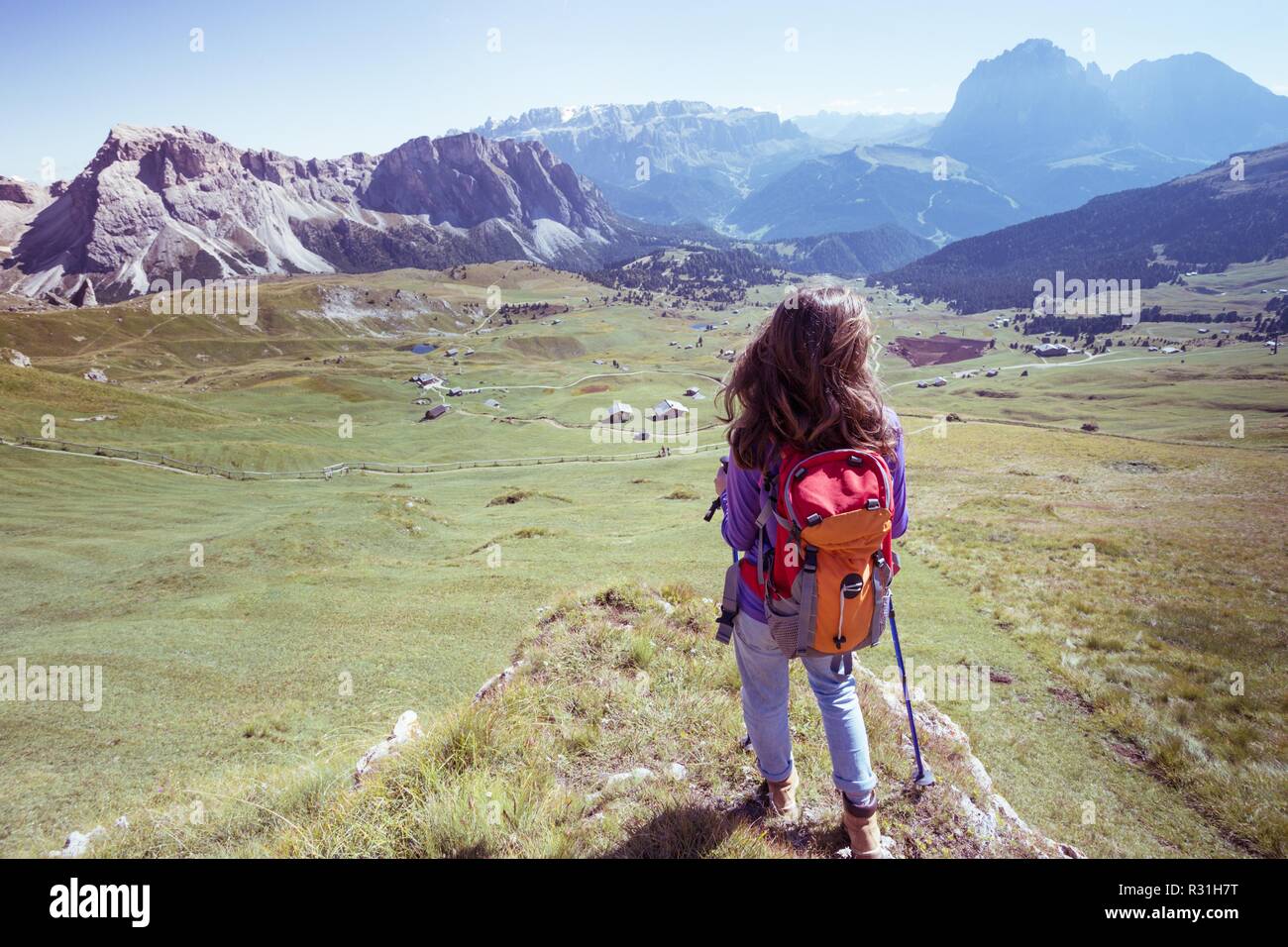 girl hiker at the mountains Dolomites and views of the valley, Italy ...