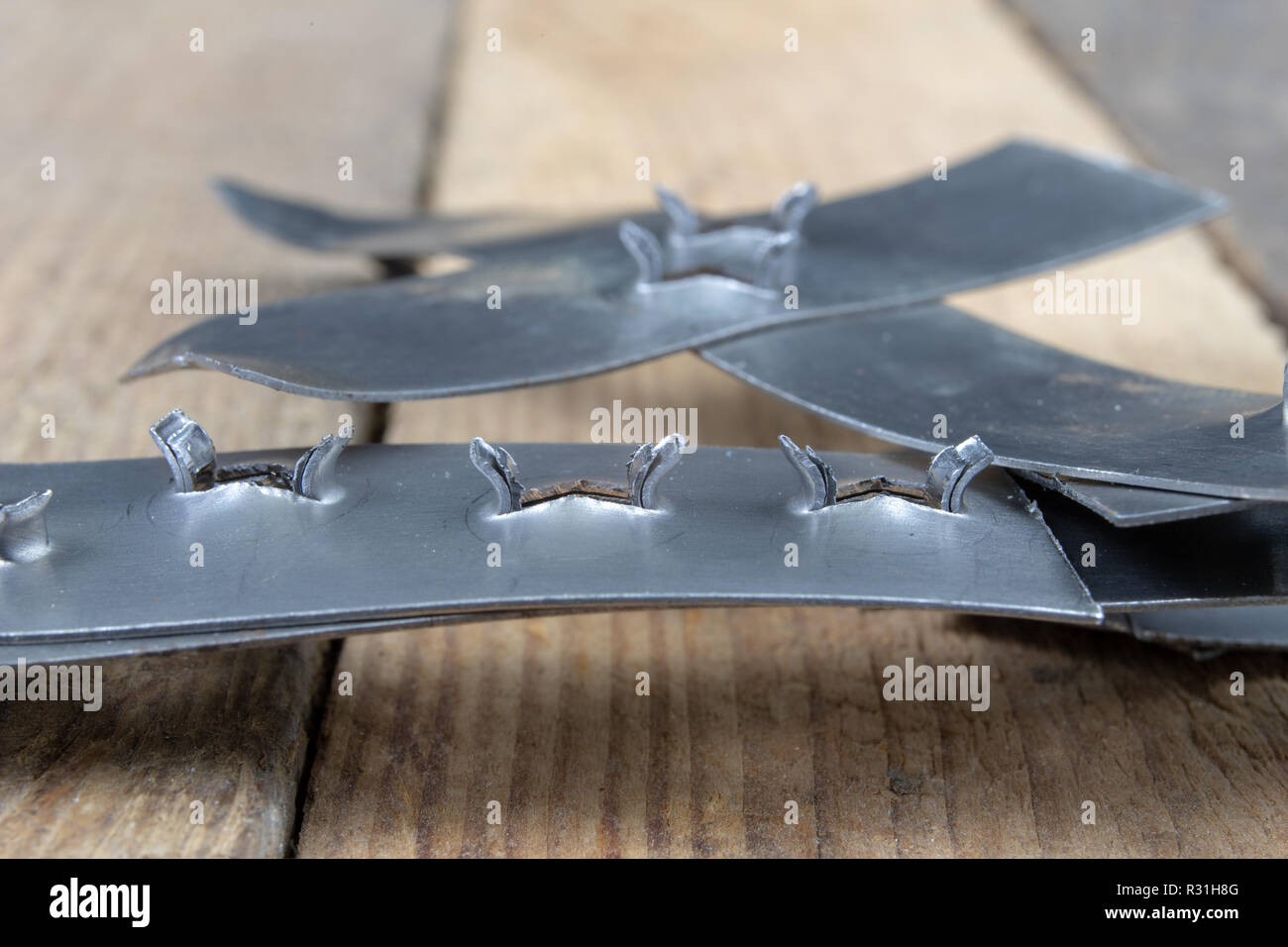 Bonding a sheet metal using a crimper. Small locksmith works in a ...