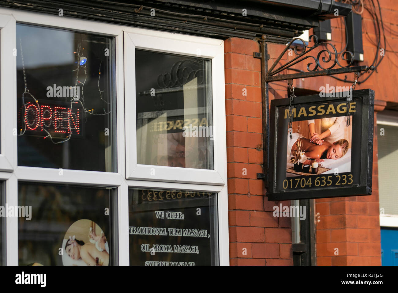 Personal body massage hanging sign in Southport, UK Stock Photo - Alamy
