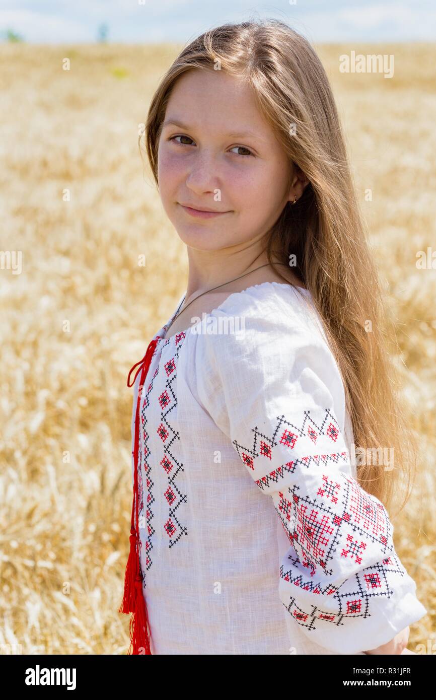 little ukrainian smiling girl in a wheat field Stock Photo - Alamy